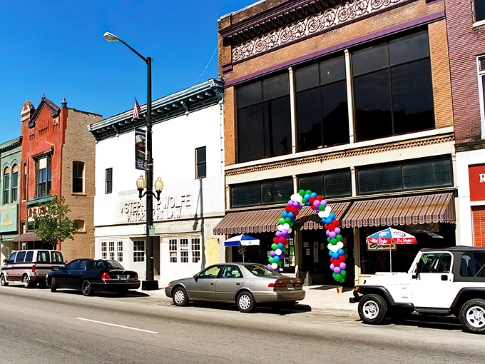 Classic storefronts stand shoulder-to-shoulder like old friends sharing secrets across generations of Hoosier history.
