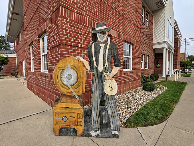 Middlebury's wooden bank robber statue tells a colorful local story. Like a Midwestern Bonnie and Clyde tale, but with better pie waiting afterward!