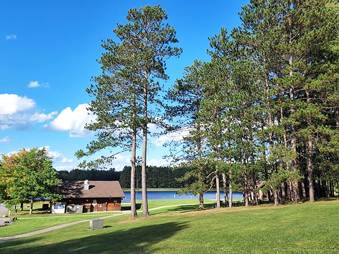 Tall pines frame the perfect lakeside retreat at Parker Dam, where that little cabin promises shelter after a day of swimming.