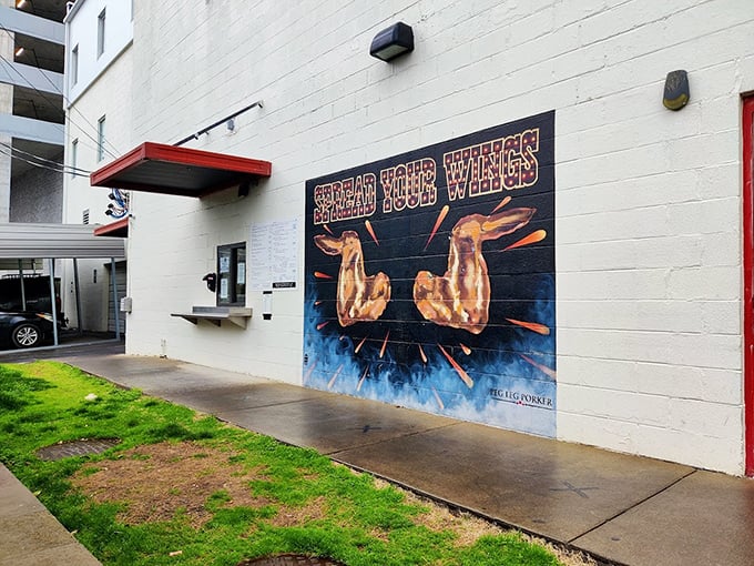 "'Spread Your Wings' indeed! This mural promises golden, crispy perfection before you even step inside."