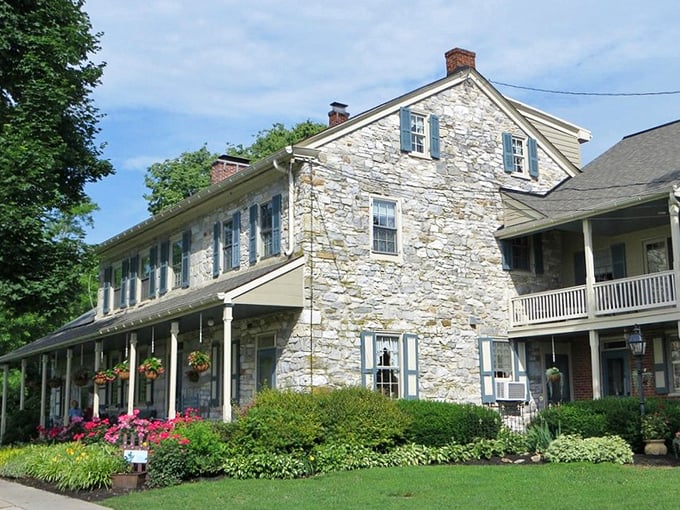 Hanging flower baskets and a welcoming porch &ndash; this stone farmhouse has been perfecting "come on in" vibes for centuries.
