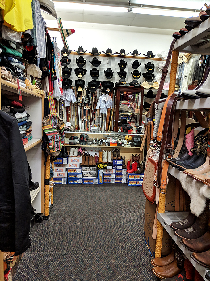 Western wear wonderland! Cowboy hats stand at attention like sentinels guarding leather treasures for the taking.