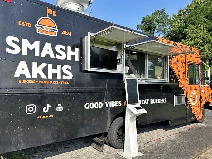 The bold black and orange Smash Akhs truck stands out like a burger beacon. Mobile deliciousness that's worth chasing across town.