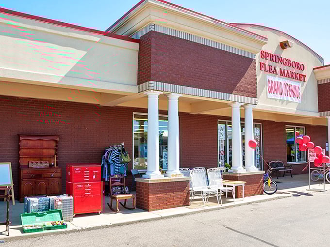 Red furniture outside hints at the colorful characters and collections waiting inside Springboro's air-conditioned bargain paradise.