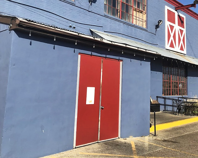 Sweet Lucy's blue exterior stands out like a BBQ beacon in Philadelphia's urban landscape.