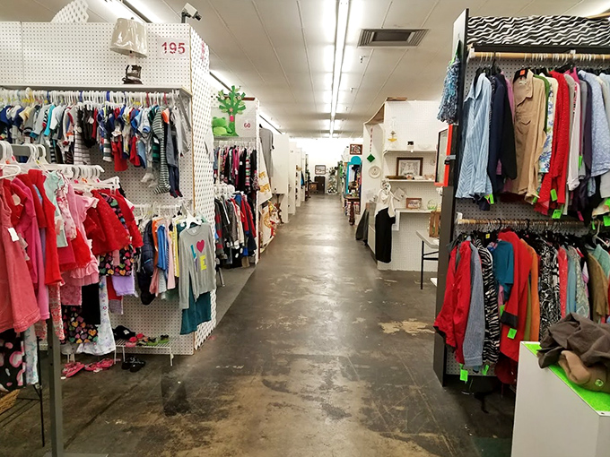 Clothing racks and collectibles create a maze of possibilities. Every aisle at Traderbaker is like turning the page in a mystery novel!