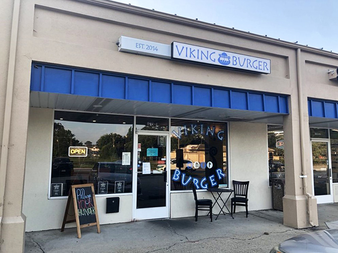Viking Burger keeps it simple with a clean storefront and "OPEN" sign. The real drama happens on your plate, not in the d&eacute;cor.