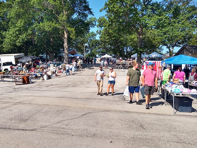 Tables stretch endlessly under blue skies, creating an outdoor shopping paradise where every step reveals new discoveries.