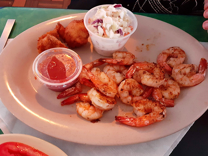 These aren't your sad buffet shrimp—these plump beauties are cooked with respect, served with slaw and a hushpuppy that deserves its own fan club.