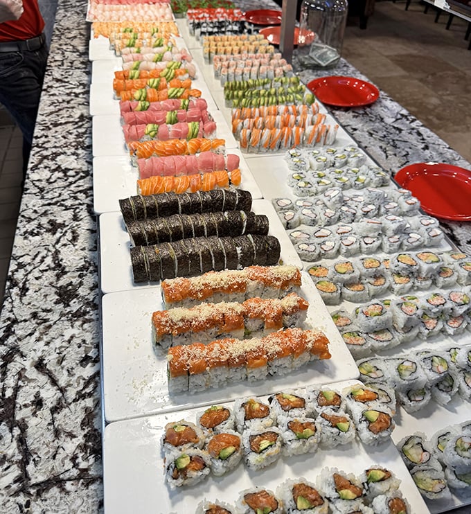 Sushi paradise stretches as far as the eye can see. Each colorful roll stands at attention, waiting for your plate's embrace.