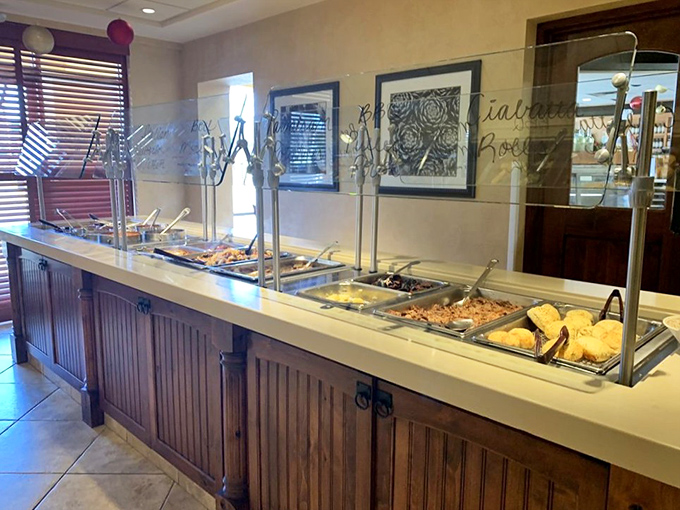 The buffet line stretches like a runway of culinary possibilities, each steam tray a different destination on your personal tour of carb-laden bliss.