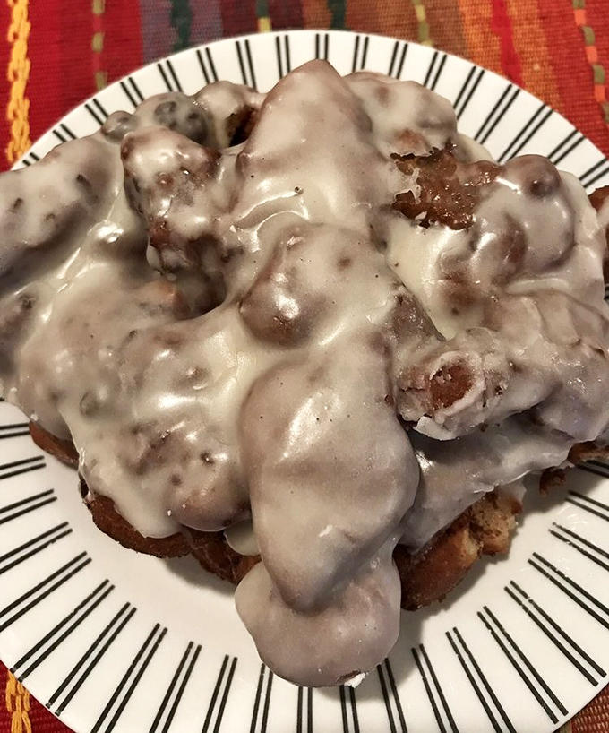 Behold the apple fritter that launched a thousand road trips &ndash; gloriously glazed chaos on a plate.