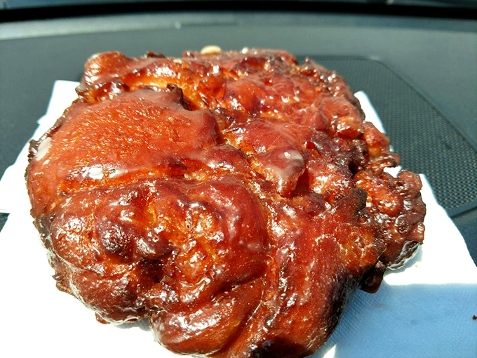 Behold the apple fritter in all its glistening glory! Crispy exterior, tender apple-studded interior &ndash; this is what breakfast dreams are made of.