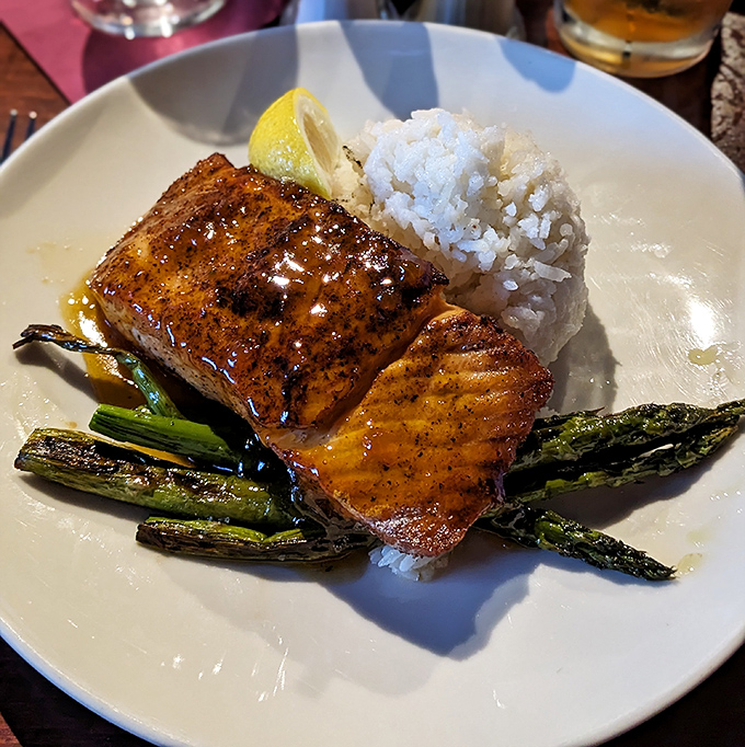 The legendary apricot salmon that launched a thousand road trips &ndash; perfectly glazed, flaky, and served with asparagus that actually makes you want vegetables.