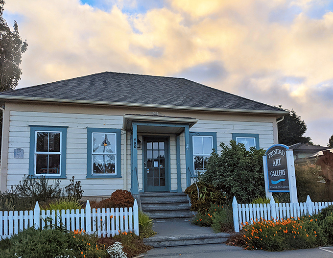 Small-town art galleries like this are where creativity thrives without pretension&mdash;the white picket fence practically whispers, "Come in, we're genuine."