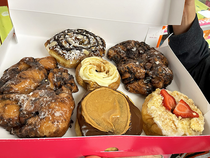 A box of pure happiness &ndash; each donut telling its own delicious story of glaze, chocolate, and possibility.