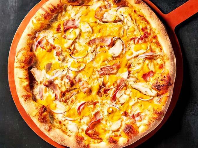 The BBQ Chicken Pizza that launched a thousand cravings&mdash;where tangy sauce meets melty cheese in a relationship more harmonious than most Hollywood marriages.