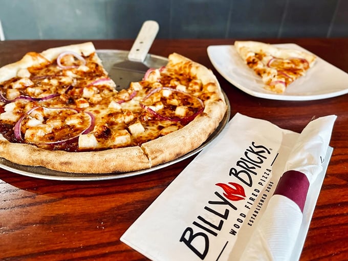 BBQ chicken pizza that makes you question your pizza loyalties. The char marks aren't accidents; they're flavor autographs from the wood-fired oven.