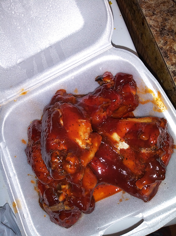 These BBQ chicken wings aren't just food&mdash;they're an event, glistening with a sauce so good you'll be contemplating licking the takeout container.