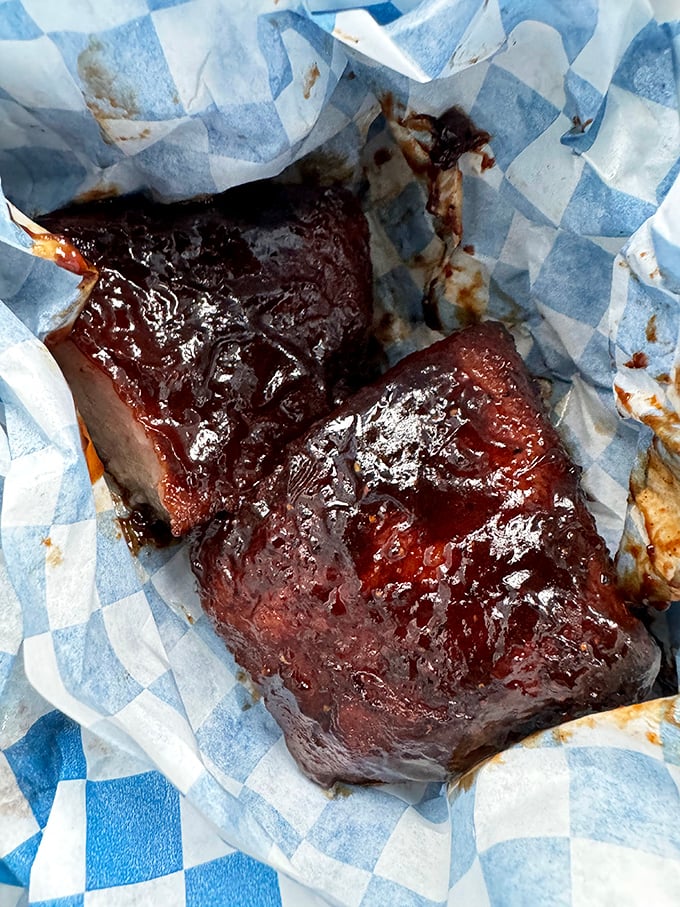 These pork belly burnt ends glisten with such perfect caramelization, they could make a vegetarian question their life choices. Sweet meets heat meets meat.