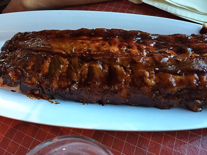 These ribs aren't falling off the bone; they're voluntarily surrendering to your taste buds in a glossy, caramelized declaration of deliciousness.