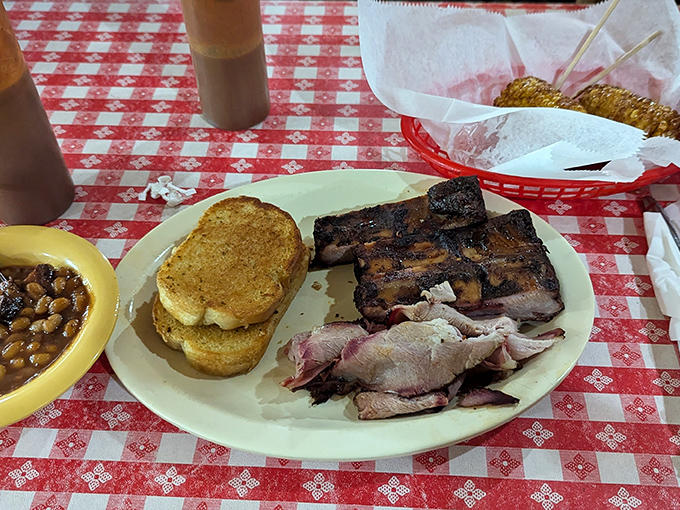 Barbecue perfection on a plate: that smoke ring doesn't lie. The kind of ribs that make conversation stop and eyes close in appreciation.
