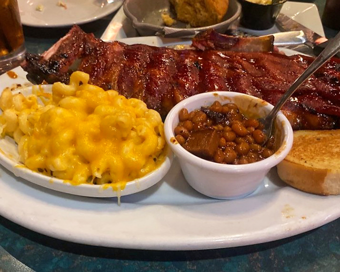 Fall-off-the-bone ribs share the spotlight with creamy mac and cheese and baked beans that have clearly been simmering since breakfast. This is Florida's version of a perfect marriage.