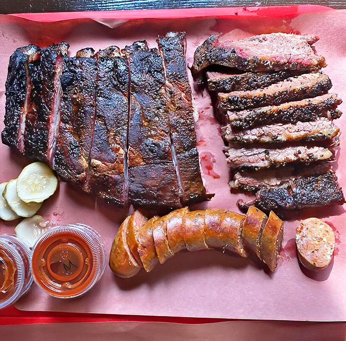 Behold the star attraction: ribs with a bark so perfect it should have its own Instagram account, alongside brisket slices that make Texans nod in respect.