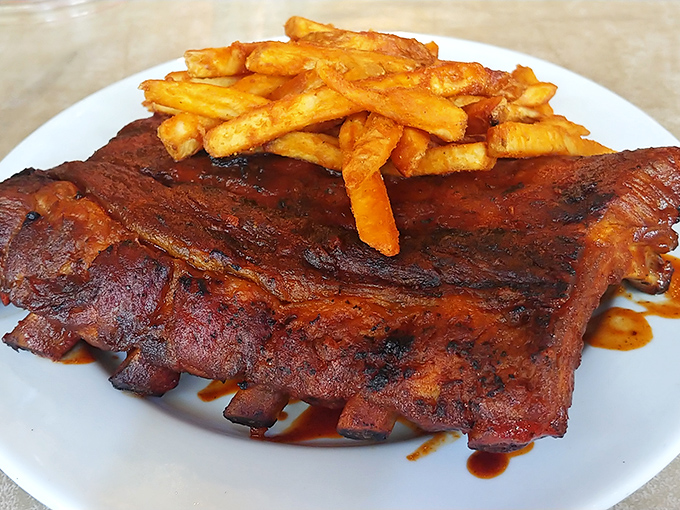 These aren't just ribs; they're edible time machines. Smoke-kissed, sauce-lacquered perfection that makes vegetarians question their life choices.