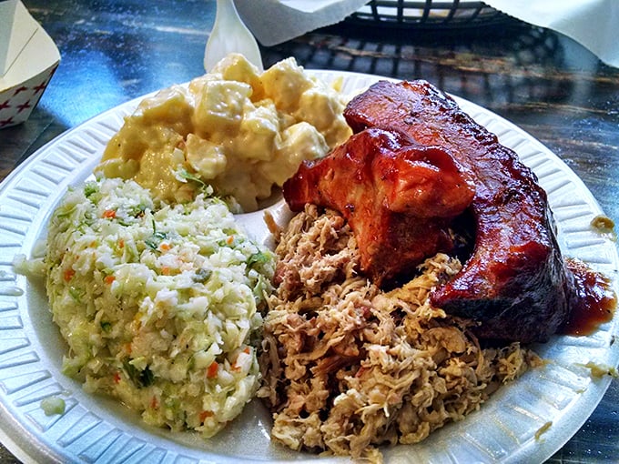 Barbecue nirvana on a plate: tender pulled pork, glistening ribs, and sides that make you question why vegetables ever got a bad rap.