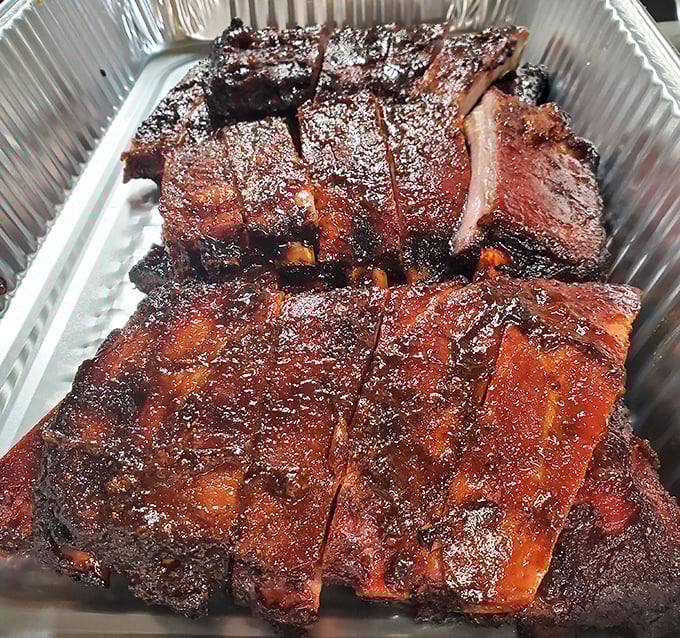These ribs have that perfect bark that makes barbecue aficionados weak in the knees &ndash; the kind of smoke ring that tells stories of patience.
