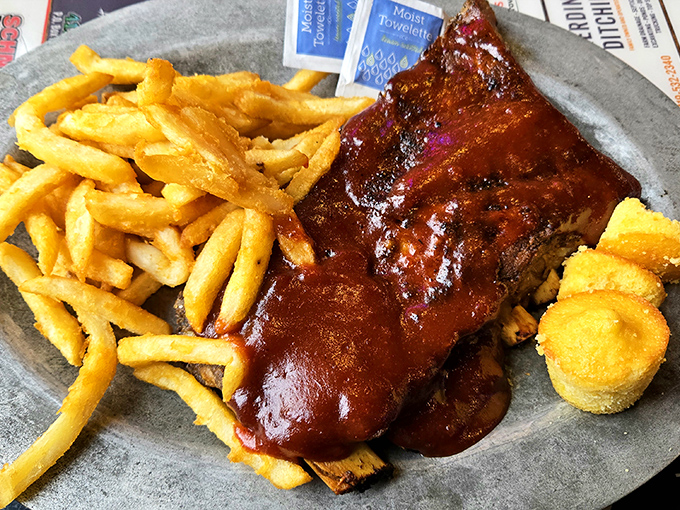 Behold, the star of the show! These ribs don't just fall off the bone—they practically leap into your mouth, trailing that glorious sauce behind them.