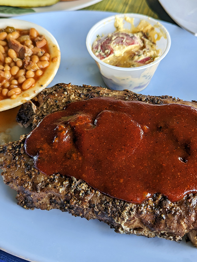 BBQ perfection doesn't happen by accident. These slow-cooked ribs with house sauce and classic sides might just make you consider moving to Marathon permanently.