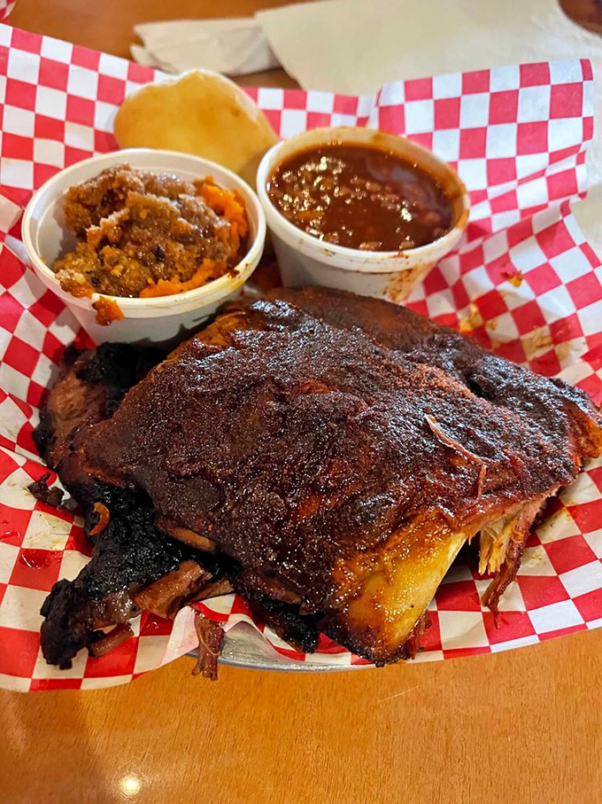 Behold the holy trinity: fall-off-the-bone ribs, sweet potato crunch, and baked beans. Napkins required, diet resolutions forgotten.