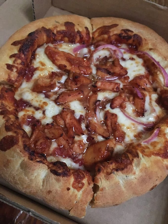 BBQ chicken pizza with that perfect caramelized edge – where the sauce meets the crust in a beautiful marriage of sweet and savory.