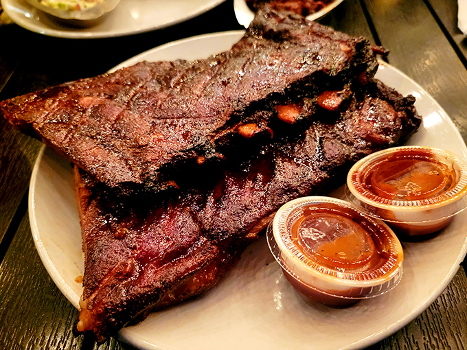 Behold the barbecue holy grail: ribs with that perfect smoke ring and bark that makes you want to compose poetry or propose marriage.