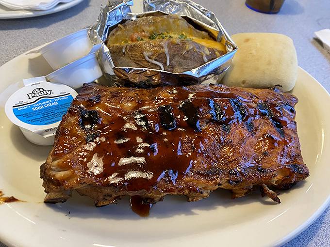 These ribs don't just fall off the bone&mdash;they practically leap into your mouth, glistening with sauce that should be bottled and sold as happiness.