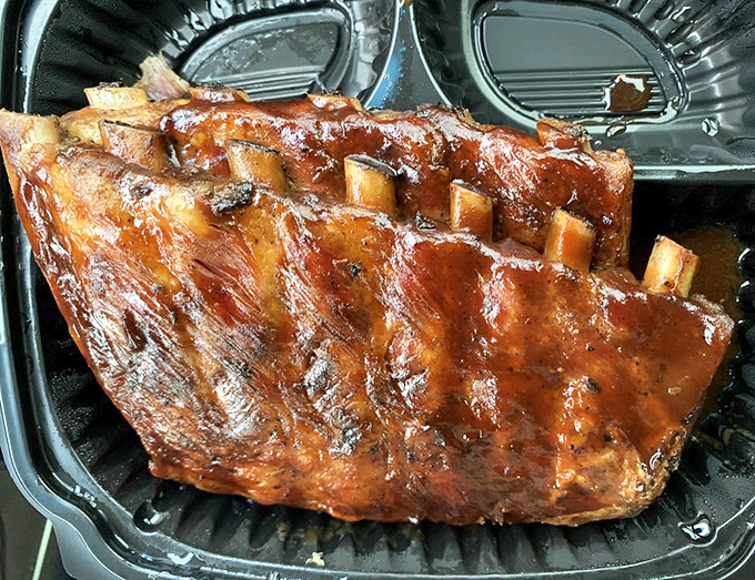 Glistening with sauce and sporting that perfect pink smoke ring, these ribs aren't just food&mdash;they're edible poetry that speaks the universal language of barbecue.