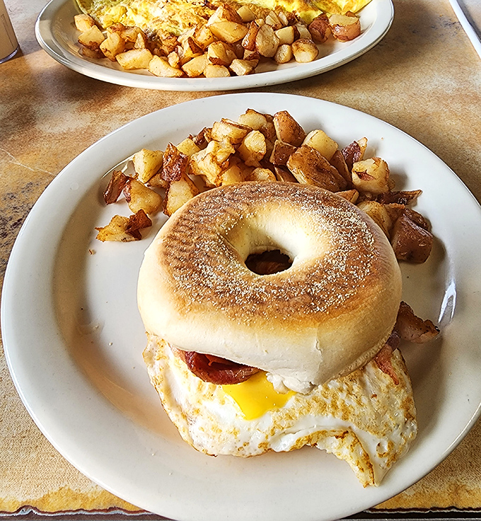 Breakfast architecture at its finest&mdash;a perfectly toasted bagel sandwich with home fries so crispy they deserve their own fan club.