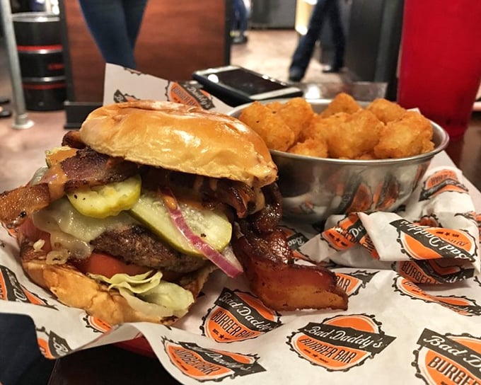 Behold the architectural marvel that is their bacon cheeseburger. Layers of savory goodness stacked so high you'll need to unhinge your jaw like a python.