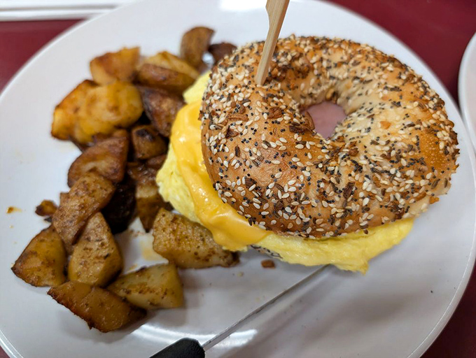 The everything bagel doesn't just have everything on it&mdash;it has everything going for it. Golden home fries playing the perfect supporting role.
