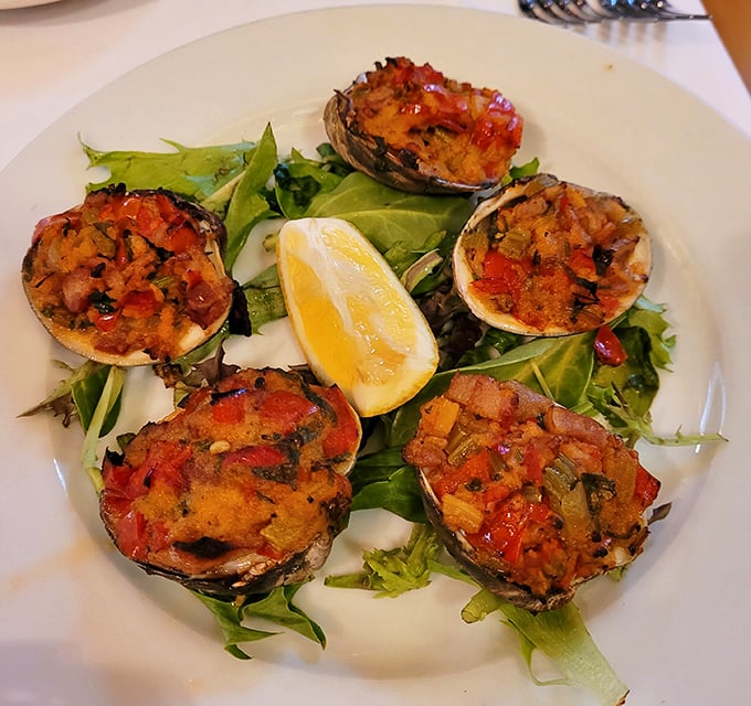 These baked clams aren't just appetizers &ndash; they're edible overtures, each shell a tiny stage for breadcrumbs, peppers, and herbs performing in perfect harmony.