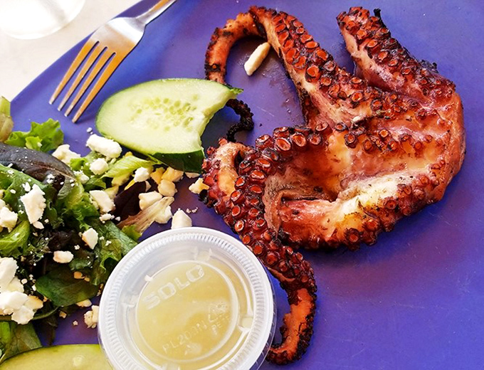Behold the star attraction: char-grilled octopus that's converted more skeptics than a televangelist, tender enough to cut with a fork.
