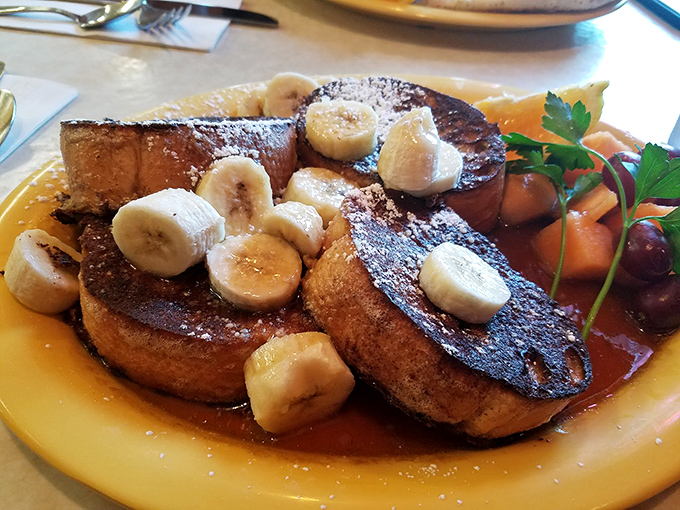 French toast that makes you question every breakfast decision you've ever made. Those bananas aren't just garnish&mdash;they're co-stars in this morning masterpiece.