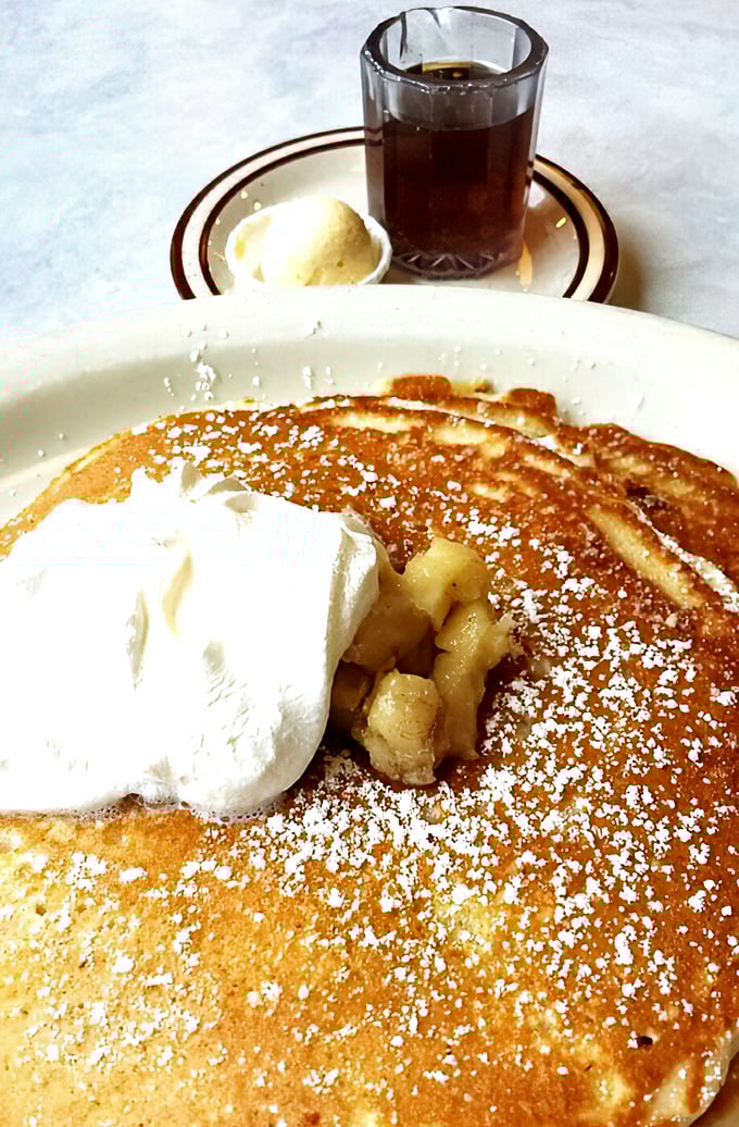 Golden pancake perfection topped with a cloud of whipped cream and caramelized bananas. Breakfast nirvana exists, and it comes with a side of maple syrup.