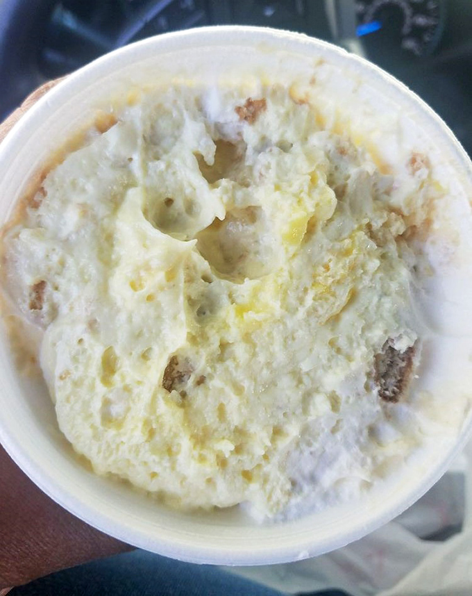 Behold the legendary banana pudding! This unassuming styrofoam cup contains creamy, vanilla-infused heaven that might just overshadow the barbecue you came for.
