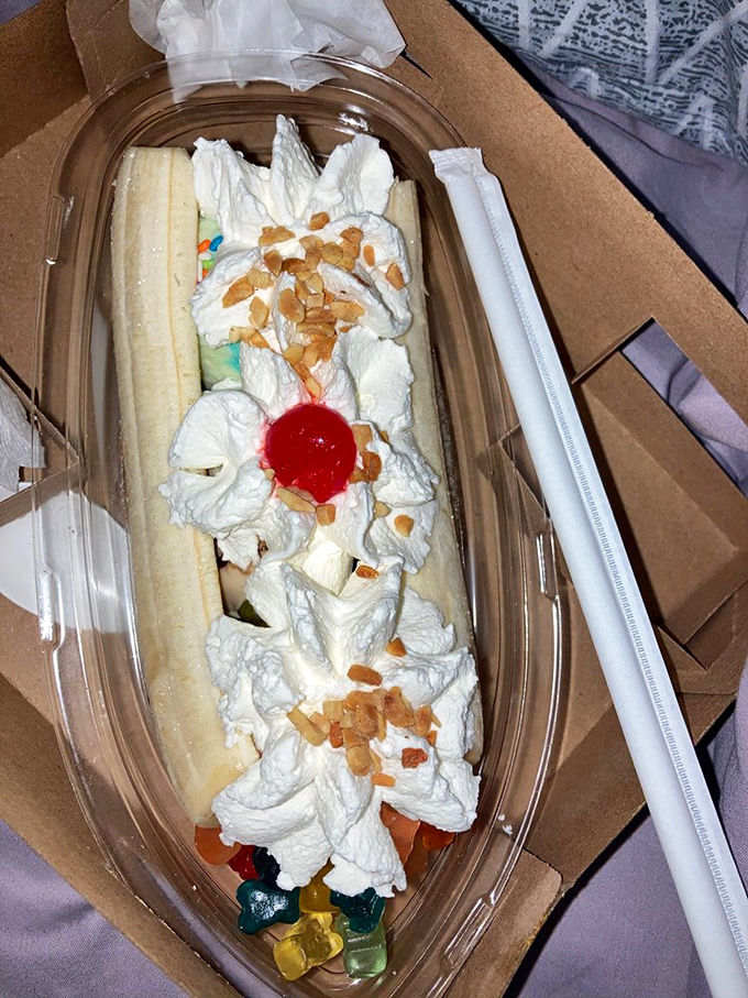 The banana split arrives like a dessert Viking ship, whipped cream sails billowing, ready to transport you to sugar Valhalla.