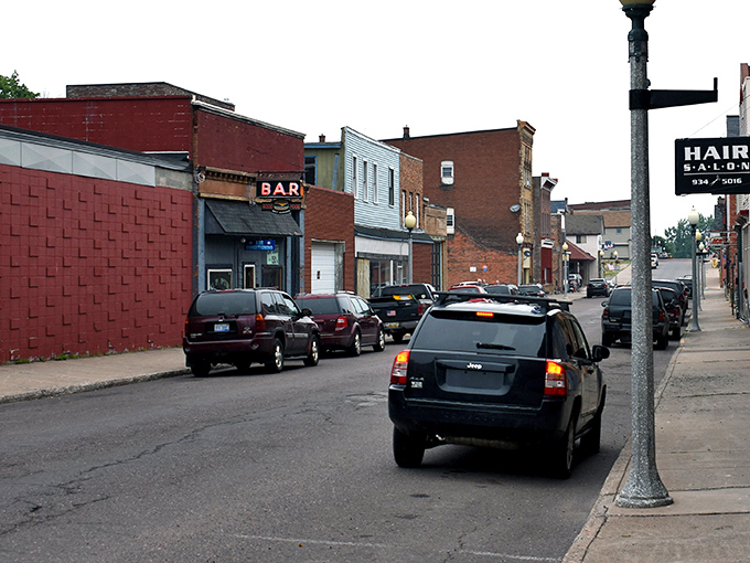 Every small town needs that one bar where the regulars have their own unassigned-assigned seats and the neon sign flickers just enough to give it character.