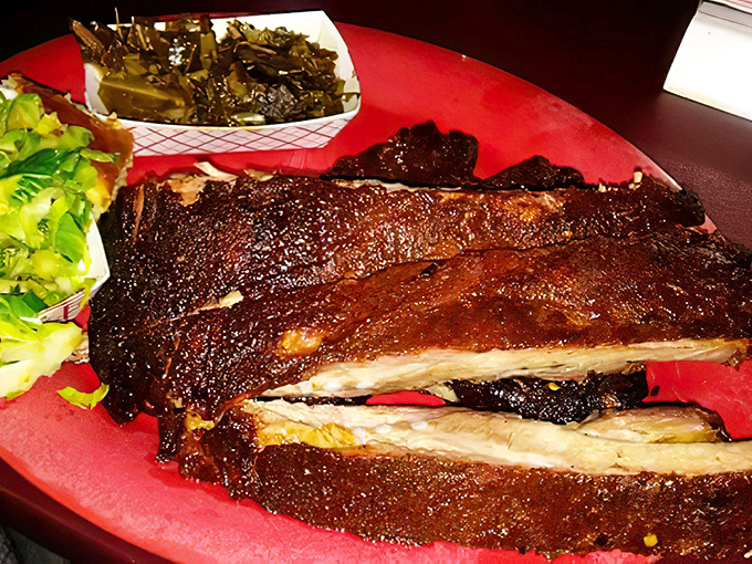 These ribs don't just fall off the bone—they practically leap into your mouth with a perfect bark that's earned its PhD in flavor development.