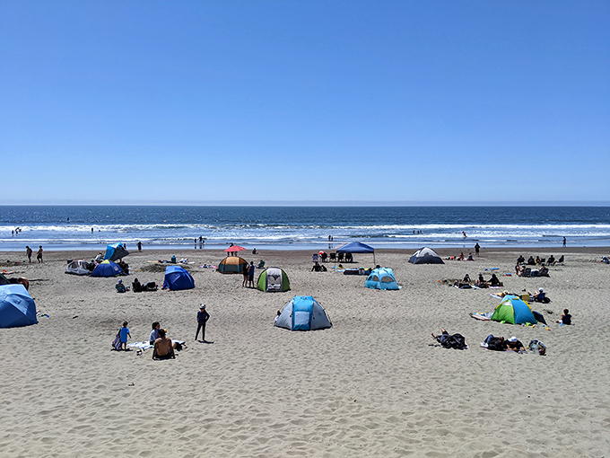 Stinson Beach beckons with its golden sands and colorful tents&mdash;proof that sometimes the best "room with a view" has no walls at all.